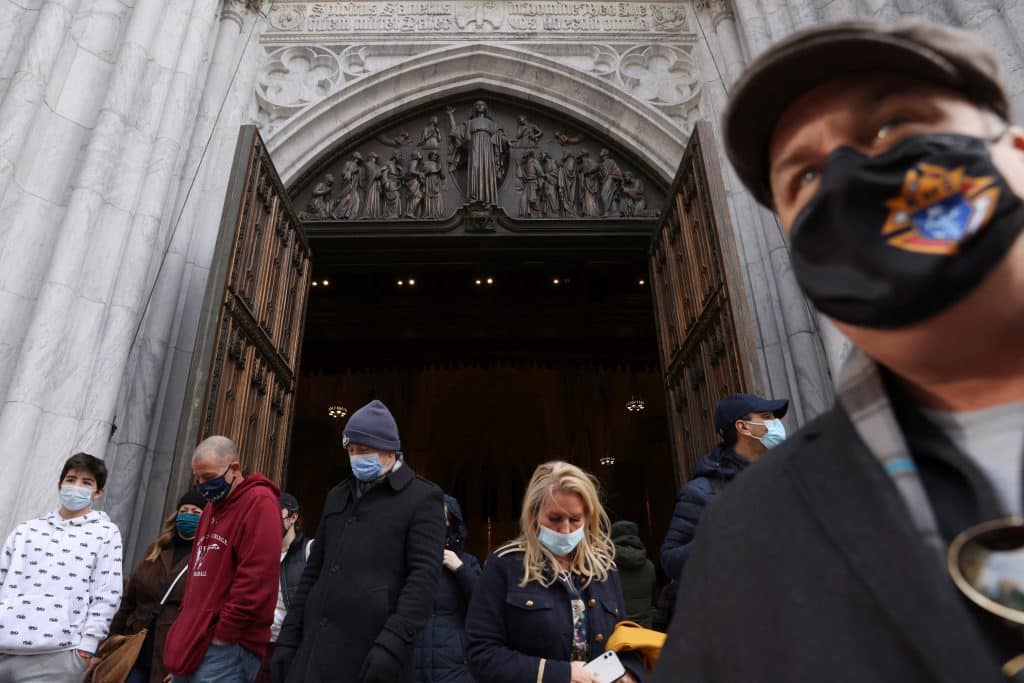 Mask mandates return in several dioceses as omicron variant surges ...