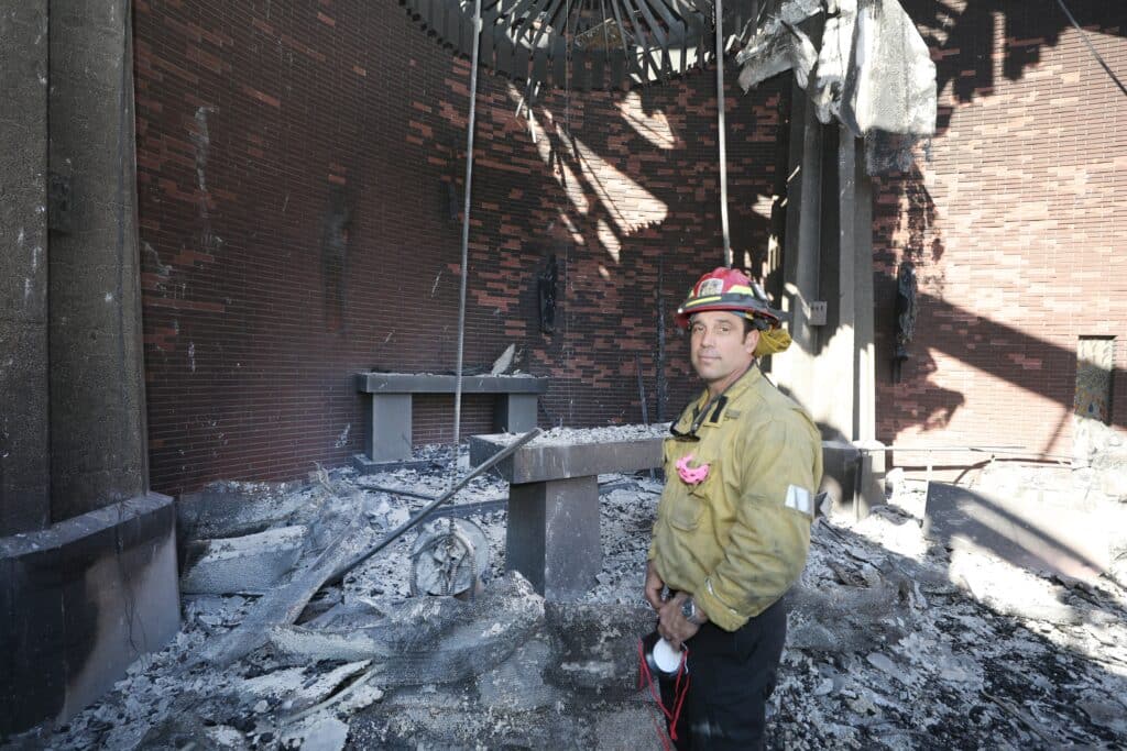 Fire captain makes way through ruins of incinerated church to find ...